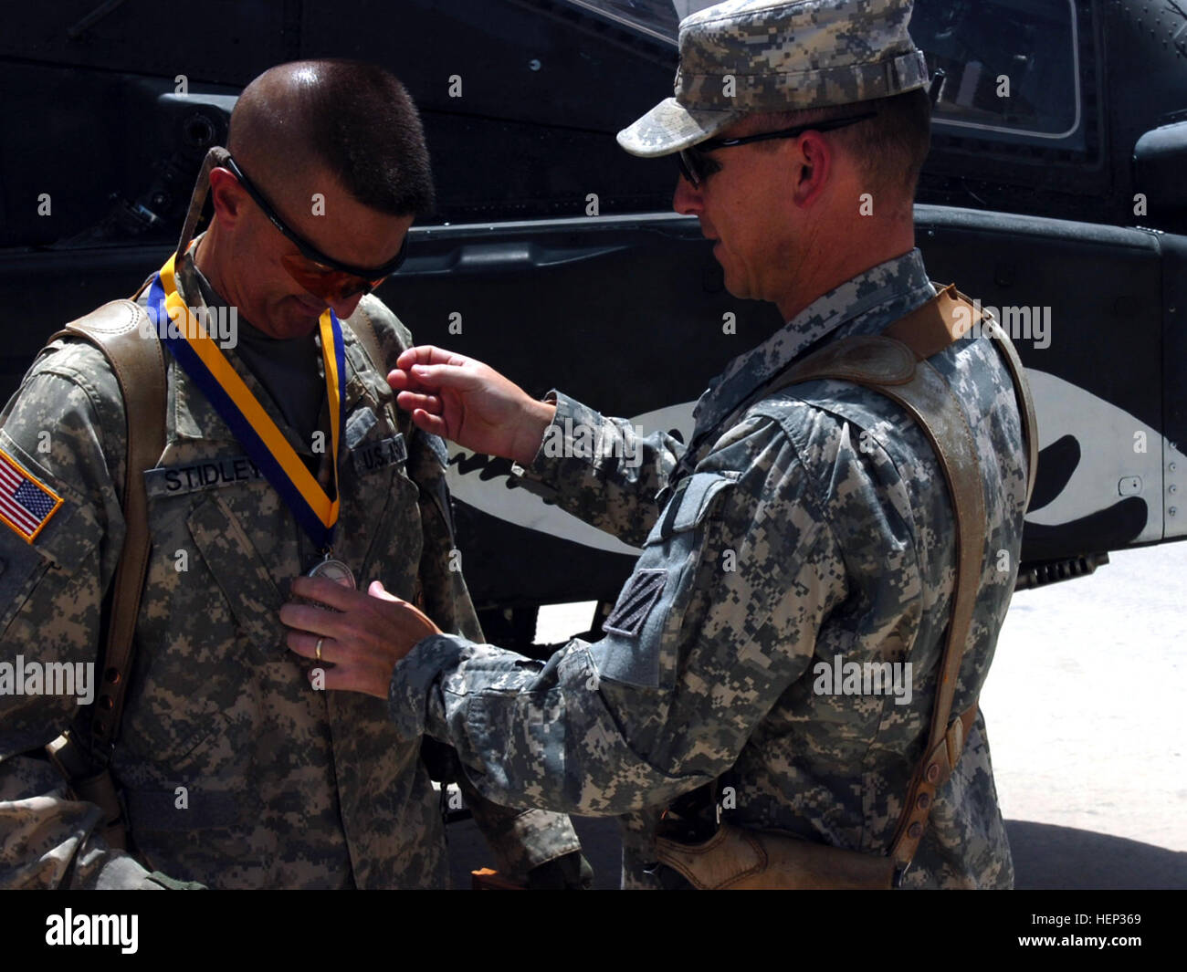 Colonel Dan Ball, commander of 3rd Combat Aviation Brigade, places the ...