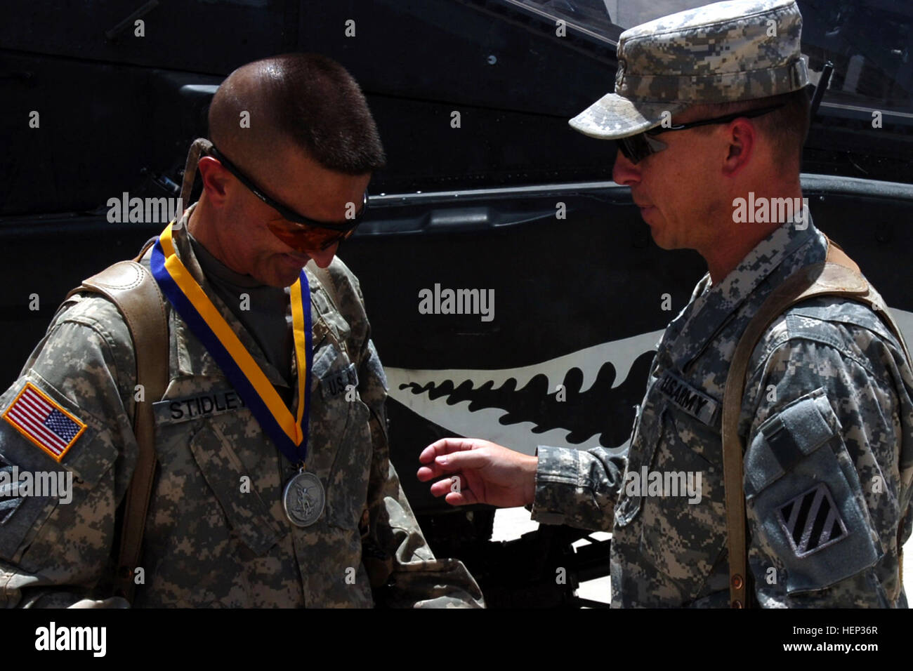 Colonel Dan Bal, commander of 3rd Combat Aviation Brigade, places the ...