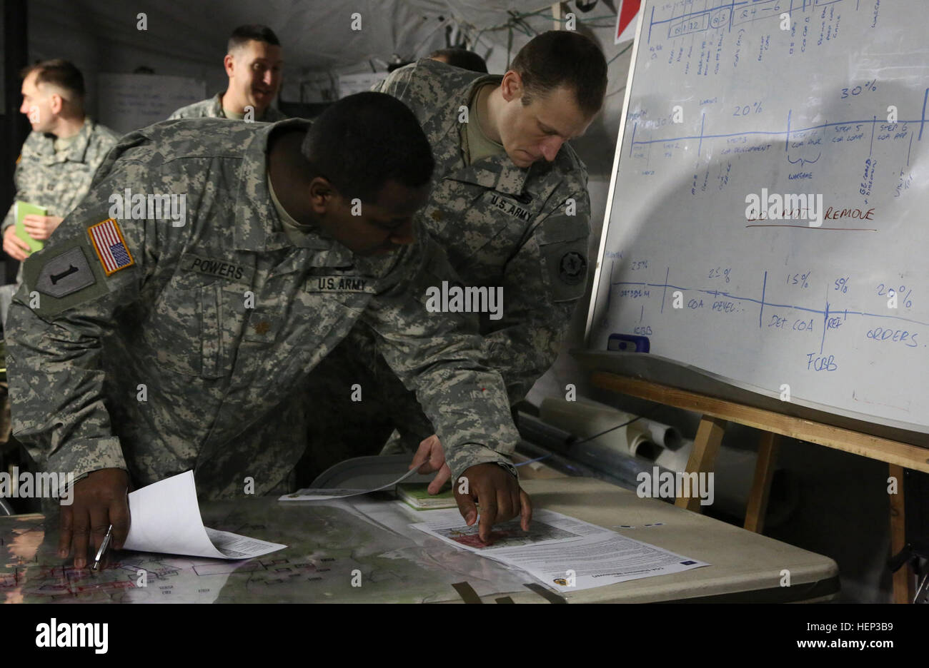 U.S. Army Maj. Tyrone Powers, left, the fire support officer, and Maj ...