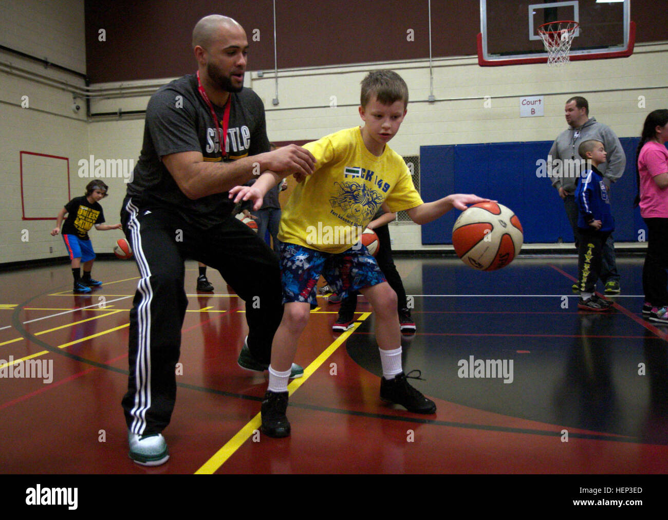 Ryan Webb, an assistant coach for the Seattle Storm, attempts to steal ...