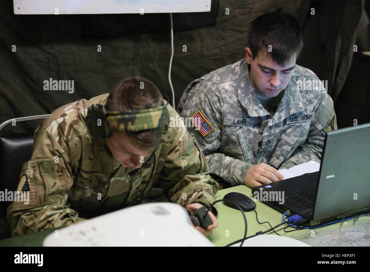 U.S. Army Pfc. Joseph Laher, right, of 4th Squadron, 2nd Cavalry ...