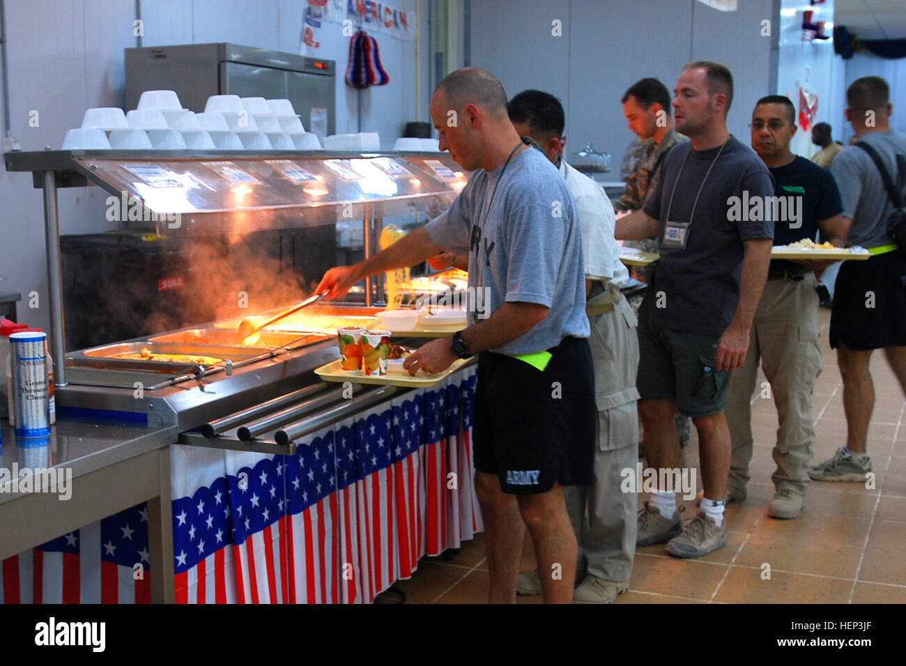 Diners wait in line at the self-serve pasta bar for their lunch-time ...