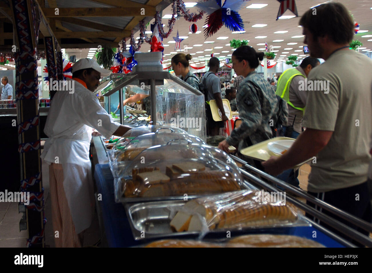 Soldiers make their lunch at the sandwich bar June 20, at Camp Striker ...