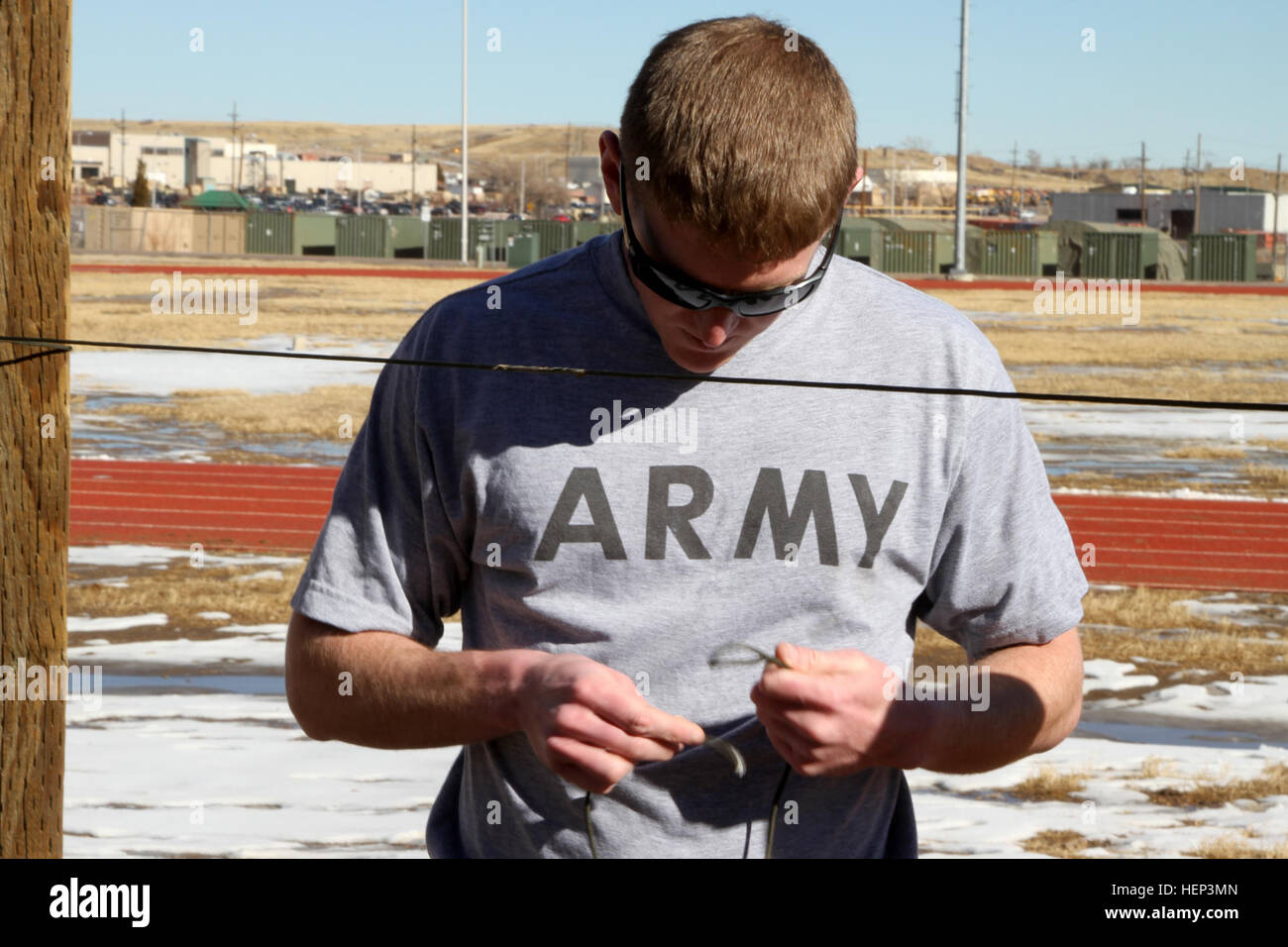 An explosive ordnance disposal specialist completes a tactical knot ...