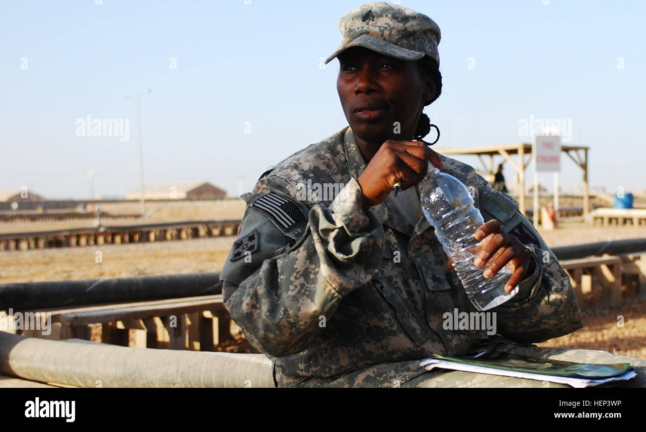 Sgt. Elsa Rudge, a Paramaribo, Suriname native, completes the paperwork ...