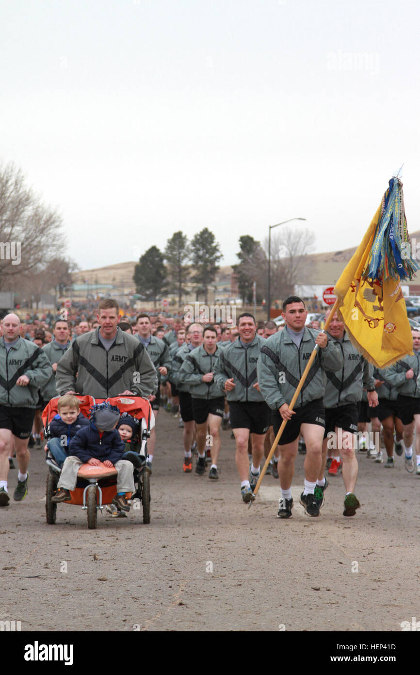 Soldiers of the 4th Infantry Division, run in formation along with ...