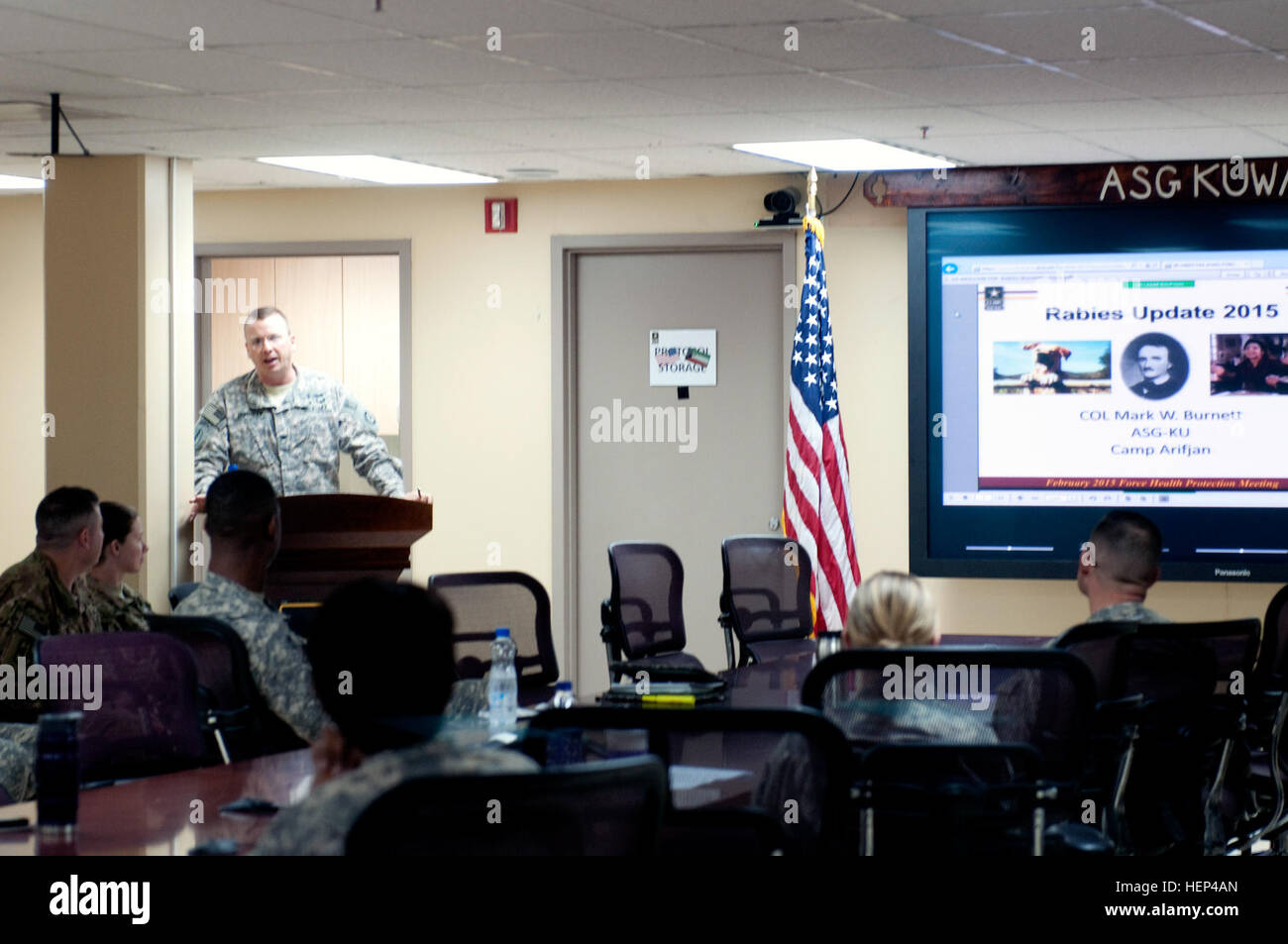 Col. Mark Burnett, command surgeon, Area Support Group-Kuwait, gives a ...
