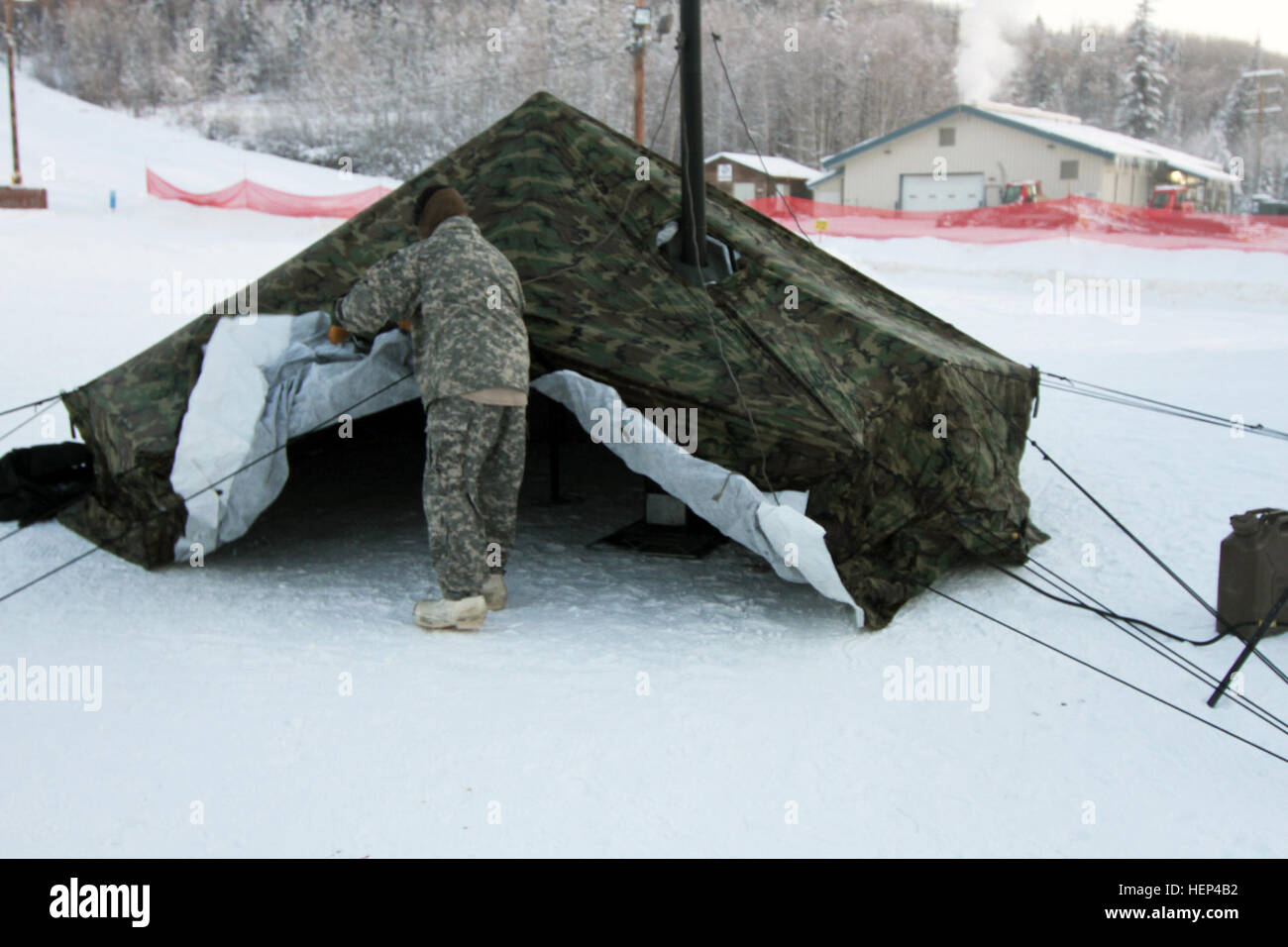 A Soldier from the Northern Warfare Training Center sets up an arctic ...