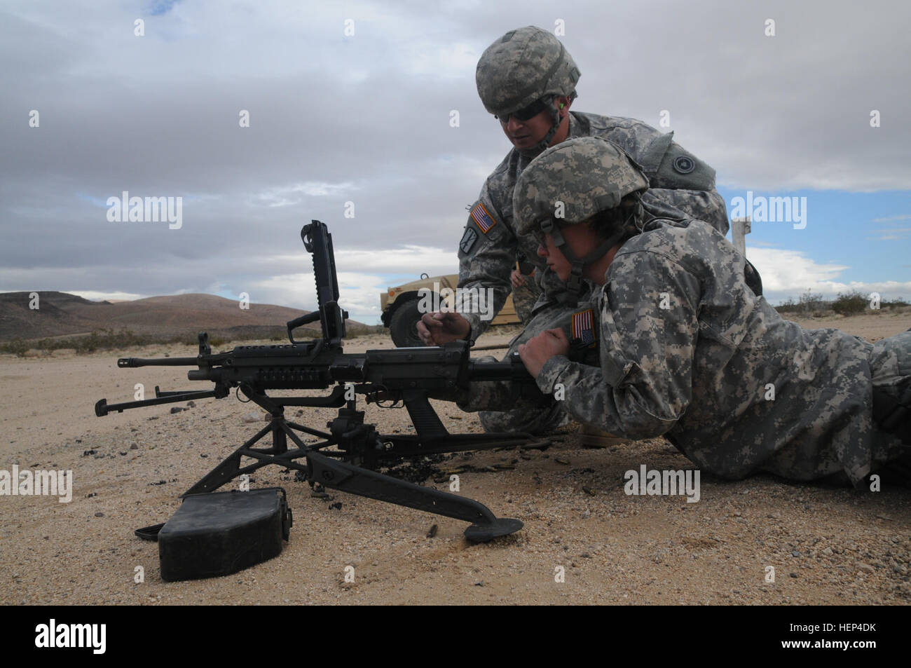 Soldiers with the 968th Quartermaster Company prepare to fire the M249 ...