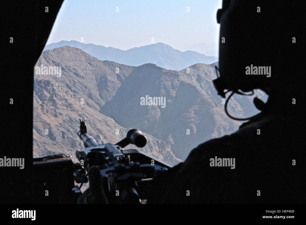 A UH-60 Black Hawk helicopter door gunner, assigned to TF Wolfpack ...