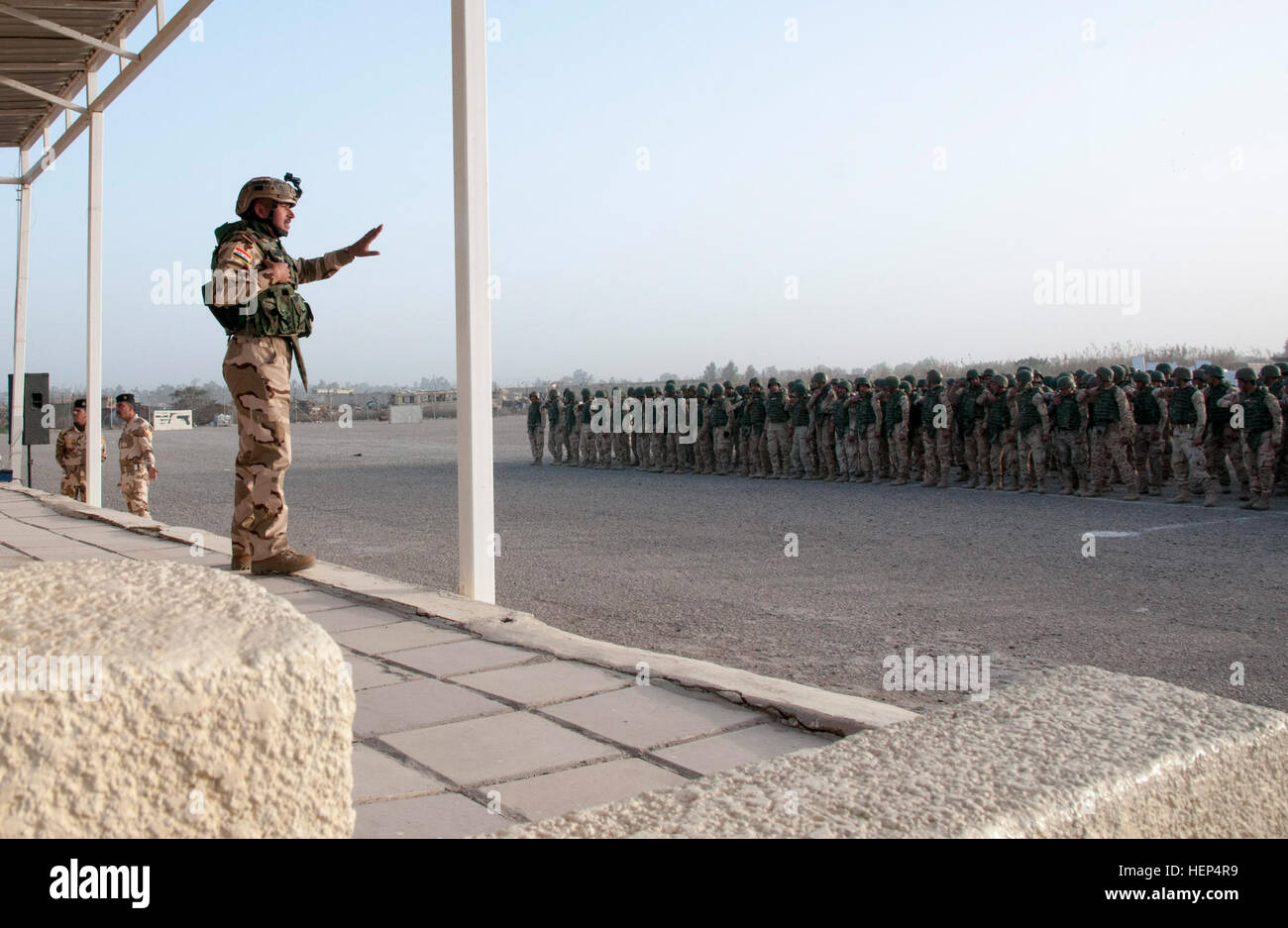 Iraqi Army Staff Lt. Col. Mohammad, left, a battalion commander with ...