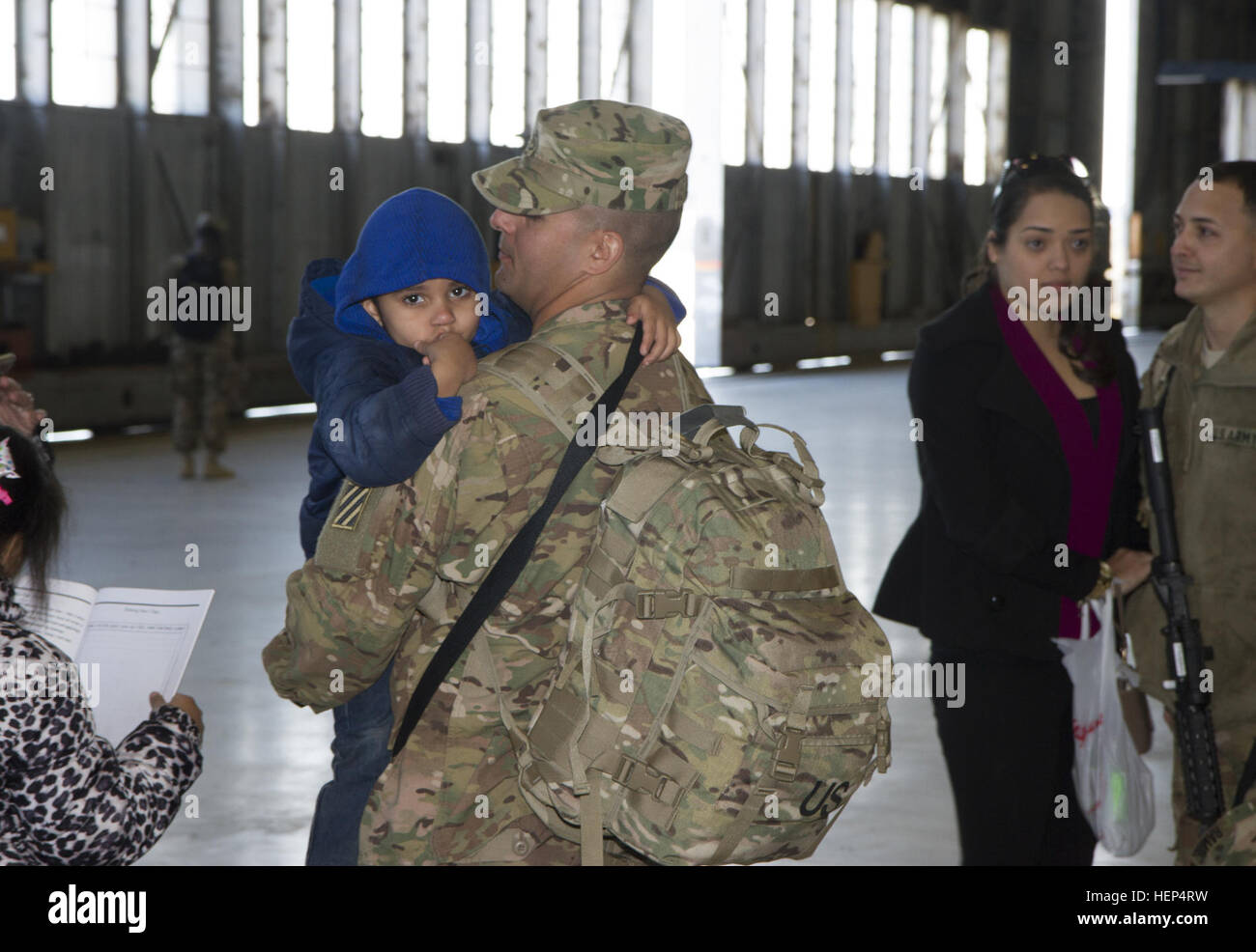 A Soldier with the 3rd Combat Aviation Brigade gets one more hug from ...