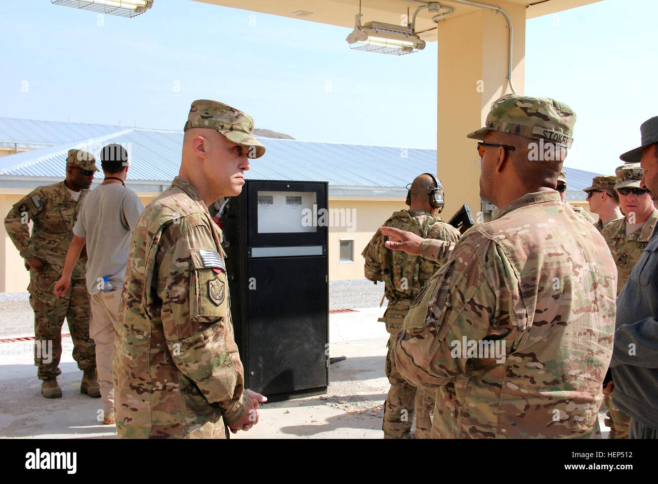 Col. Gregory Stokes, right, commander of the Police Advisory Team ...