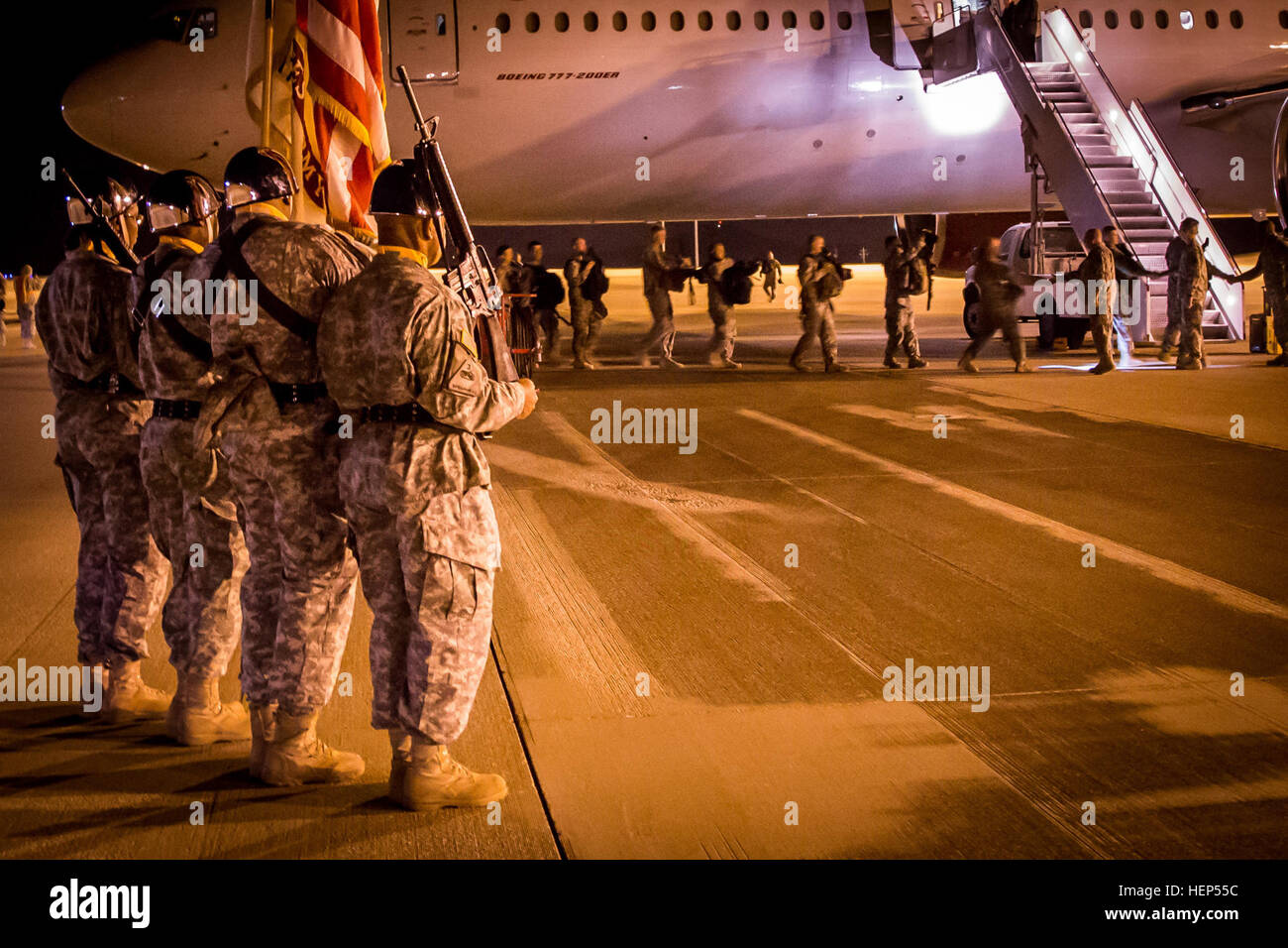 A color guard stands at attention as Soldiers of the 1-112th Cavalry ...