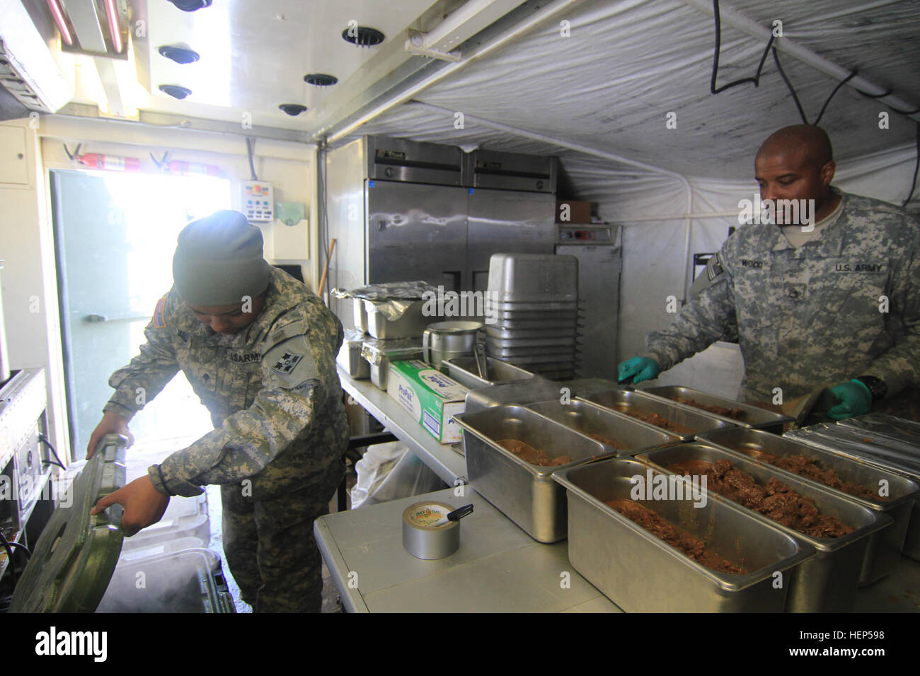 Spc. Alva Sagala (left), food service specialist, and Staff Sgt. Cory ...