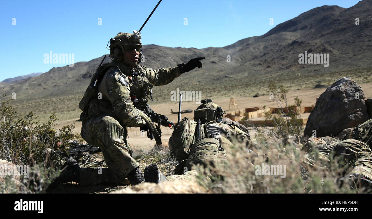 U.S. Army Rangers conduct a live-fire assault on a mock town at Fort ...