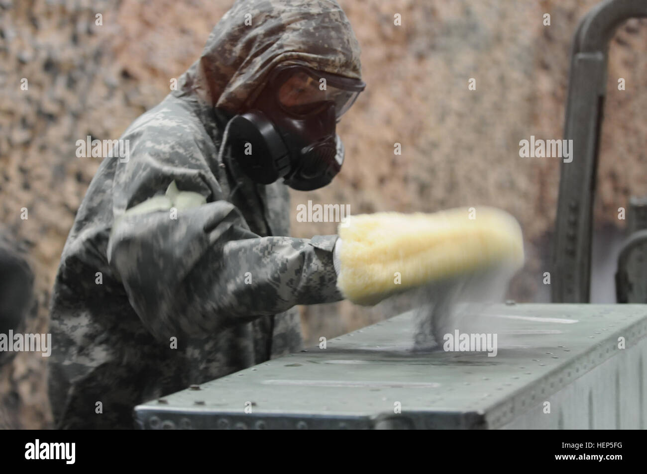 A U.S. Army paratrooper from the 82nd Airborne Division applies an M100 ...