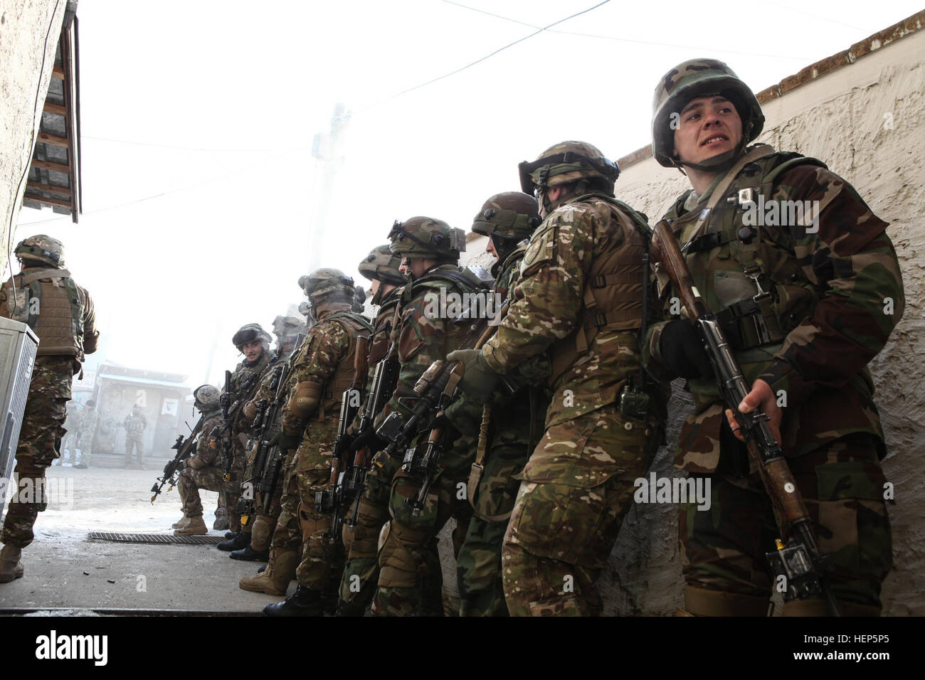 A Moldovan soldier, right, of 1st Company, 1st Battalion, Armed Forces ...
