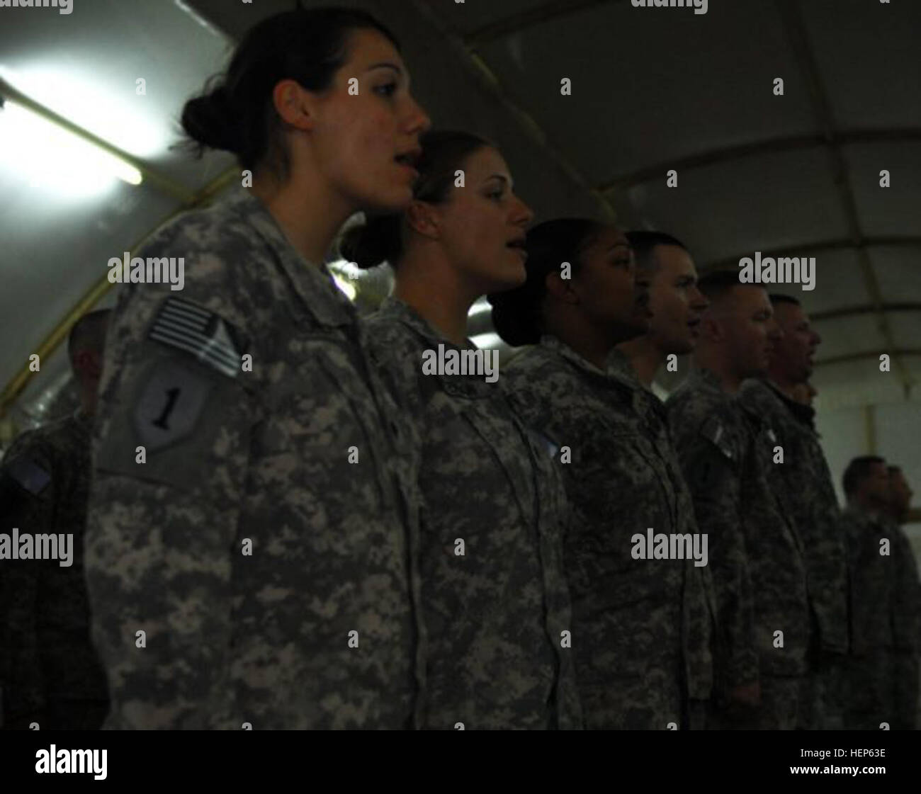 Soldiers with the 1st Infantry Division sing The Army Song during the ...