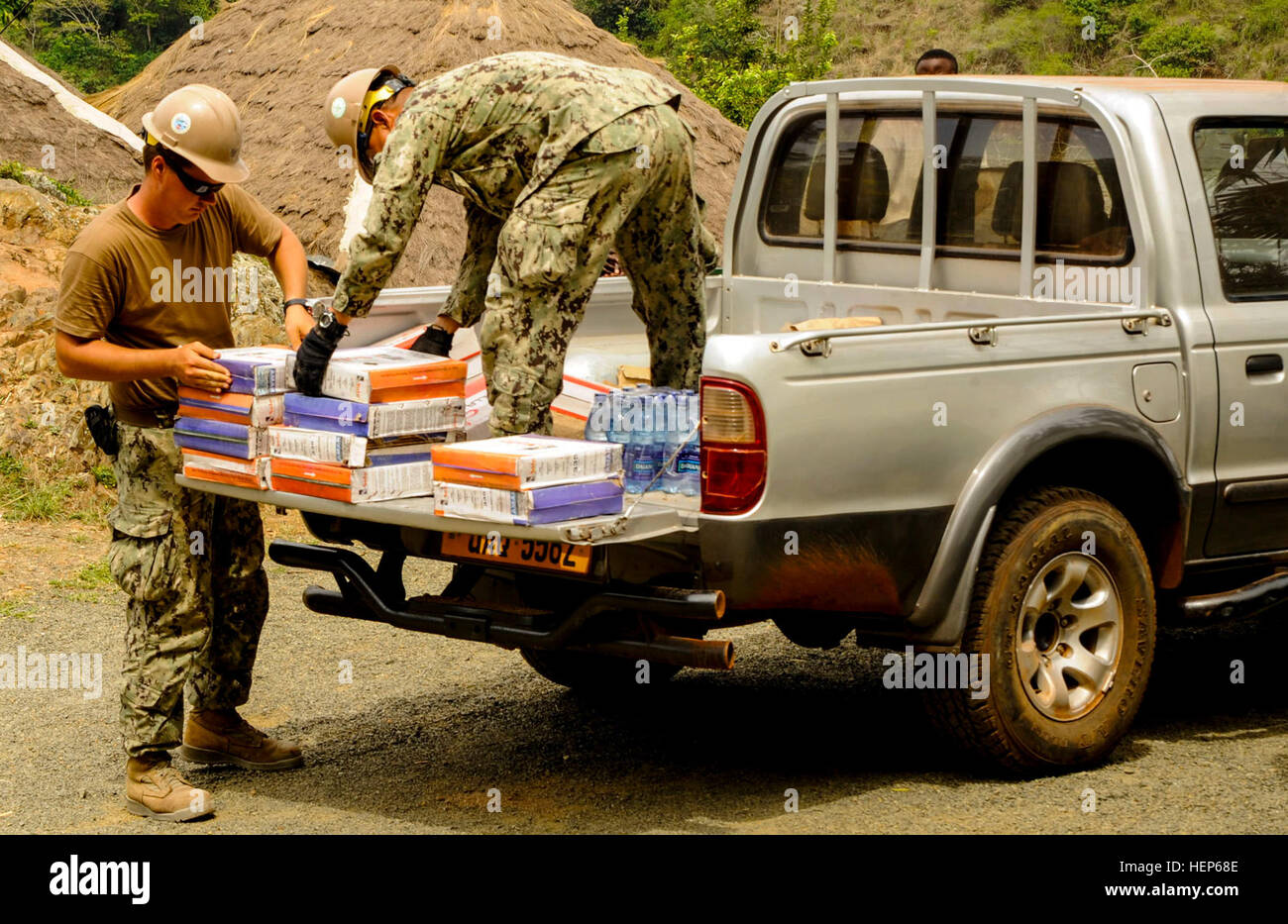 Two U.S. Navy Seabees from the Naval Mobile Construction Battalion 14 ...