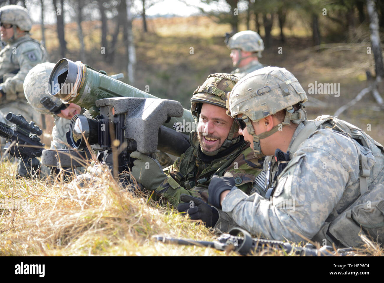 A U.S. Army paratrooper, right, assigned to the 173rd Airborne Brigade ...
