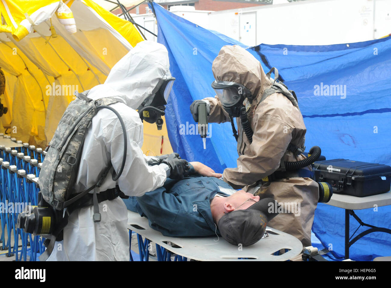 Soldiers from the 138th Chemical Company use an iCam kit to assess ...