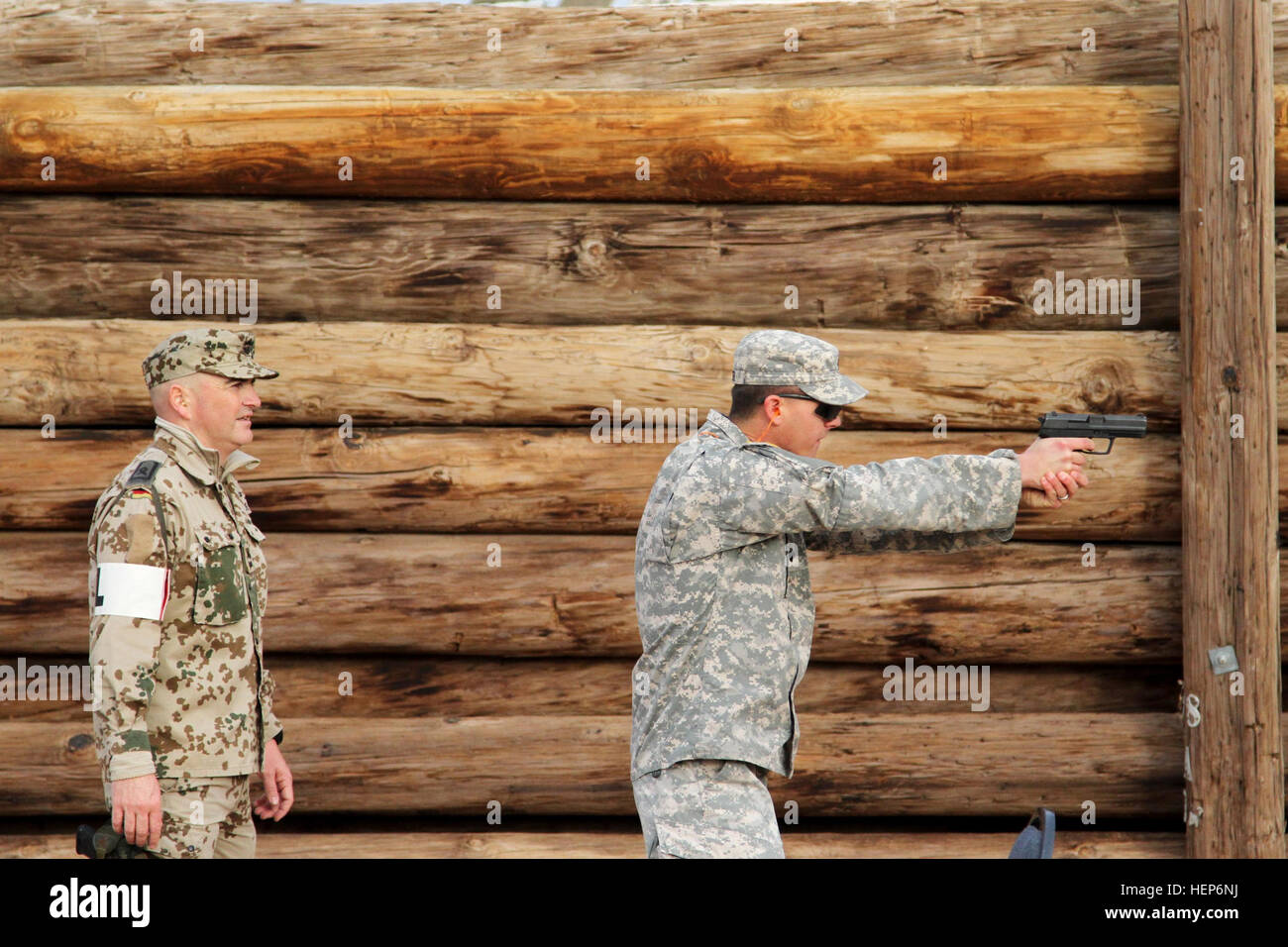 Master Sgt. Thomas Schade, German Air Force, watches a soldier shoot ...