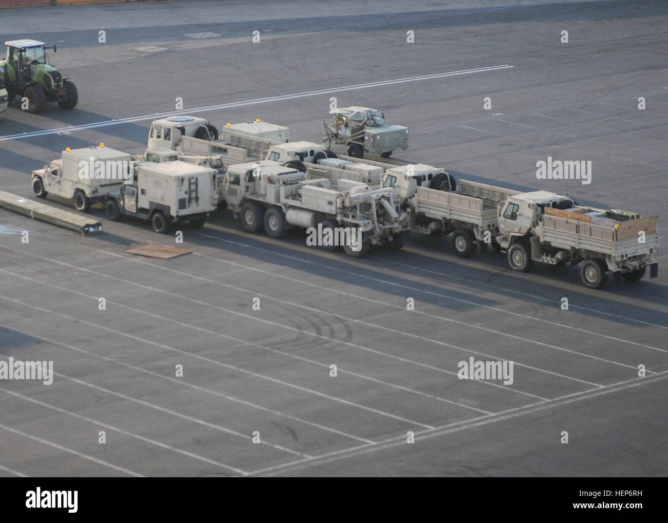 U.S. military vehicles sit outside the transportation vessel “Liberty ...