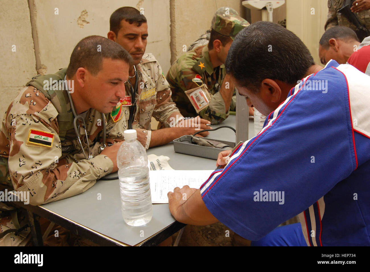 Medical personnel from the 36th Brigade, 9th Iraqi army division screen ...