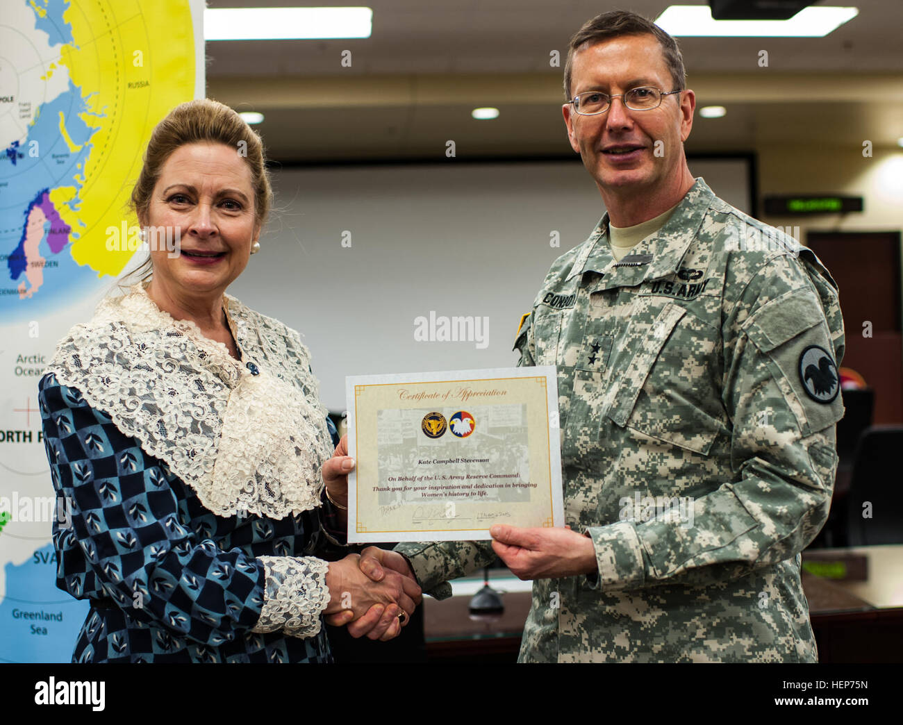 Kate Campbell Stevenson, left, is presented a certificate of ...