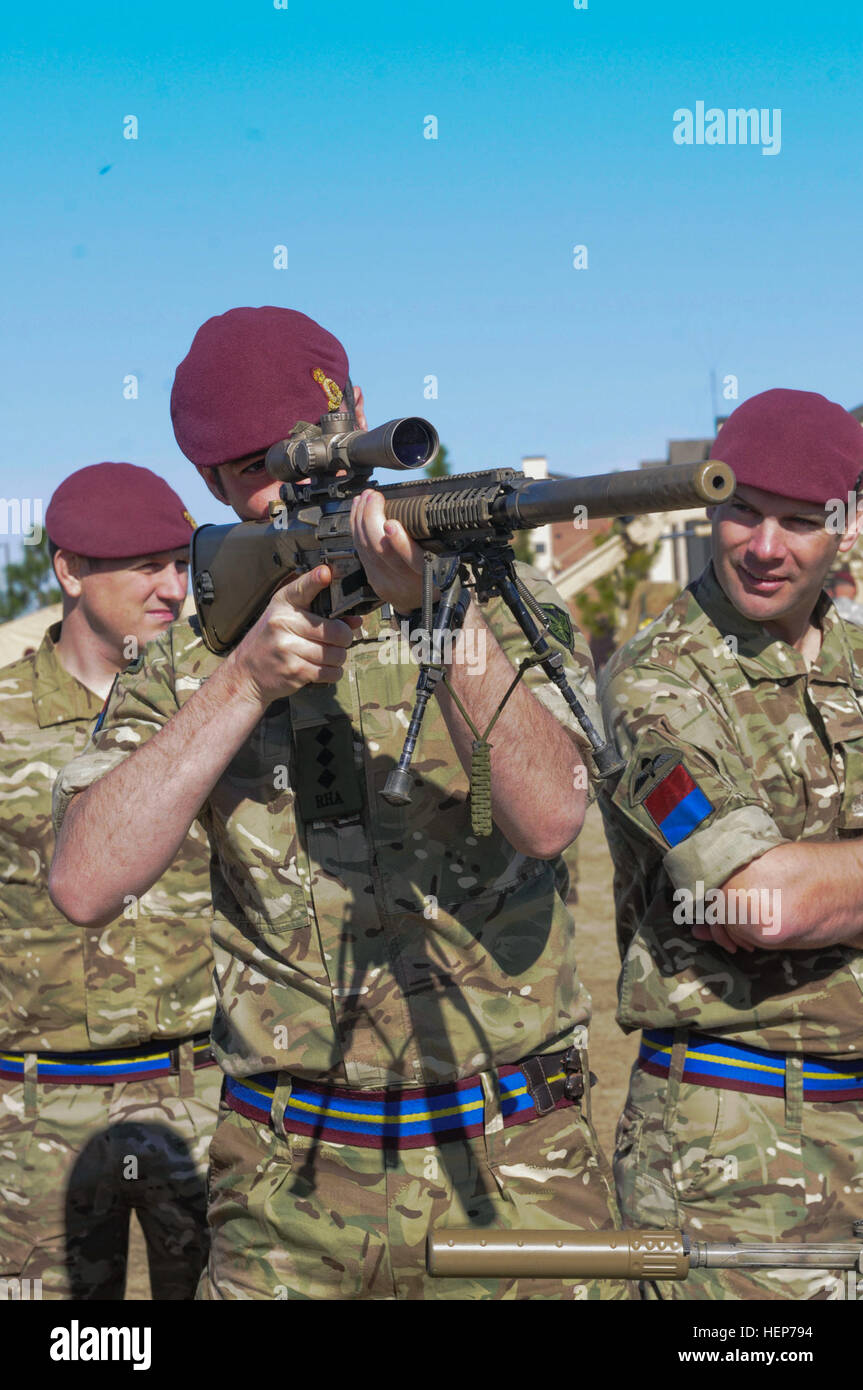 A paratrooper assigned to the British 16 Air Assault Brigade gets hands ...