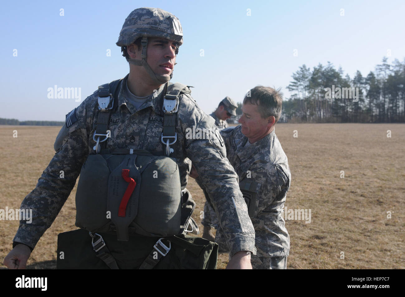 A U.S. Army operations sergeant major inspects a paratrooper’s T-11 ...