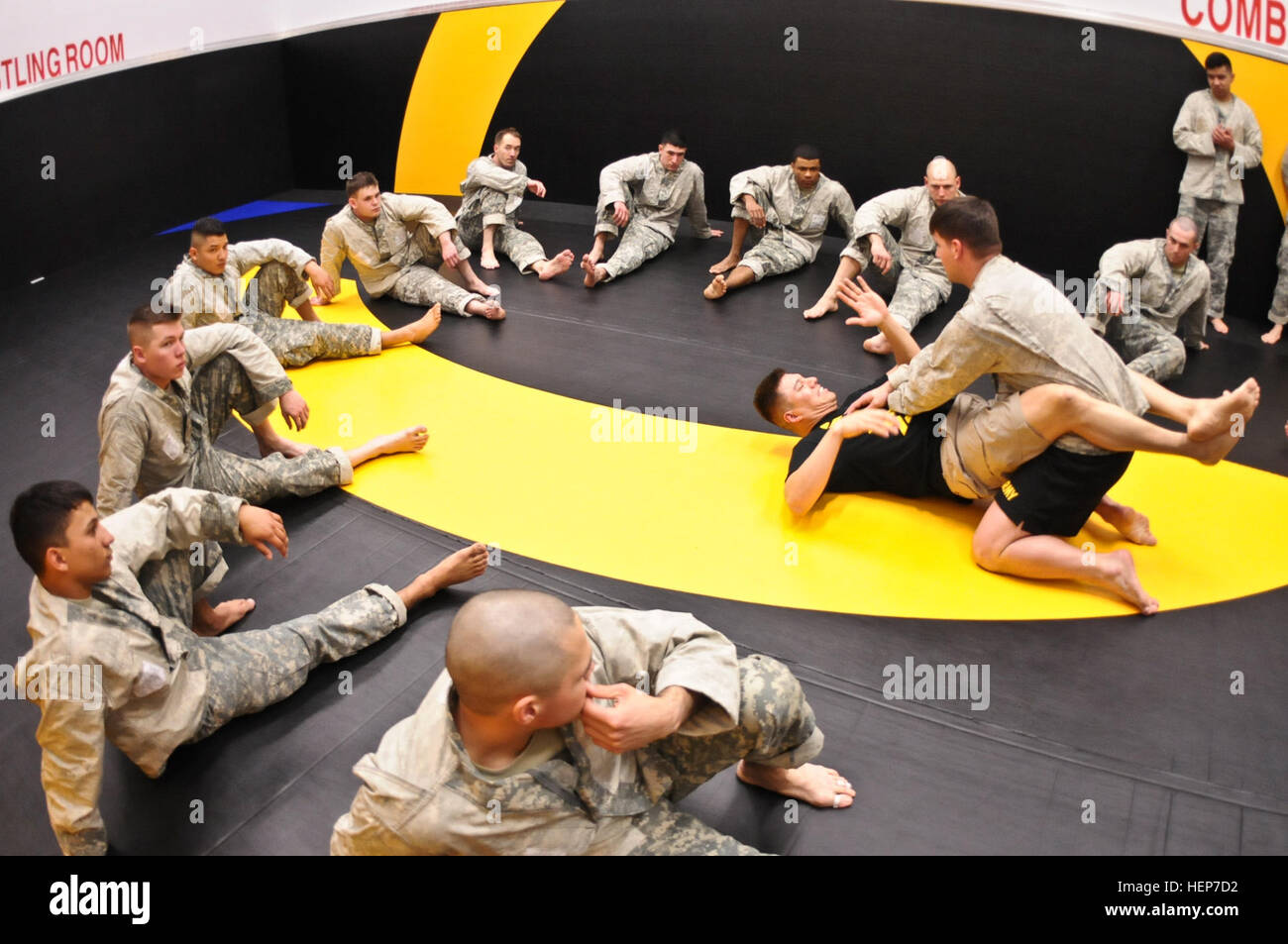 Sgt. Jesus Cisneros (bottom), a master combatives instructor and Spc ...