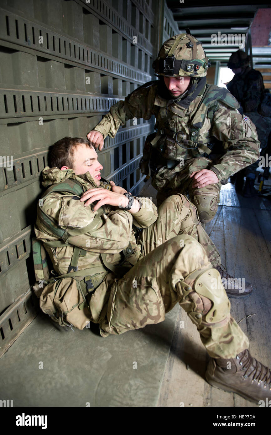 A British cadet of the Royal Military Academy Sandhurst cares for a ...