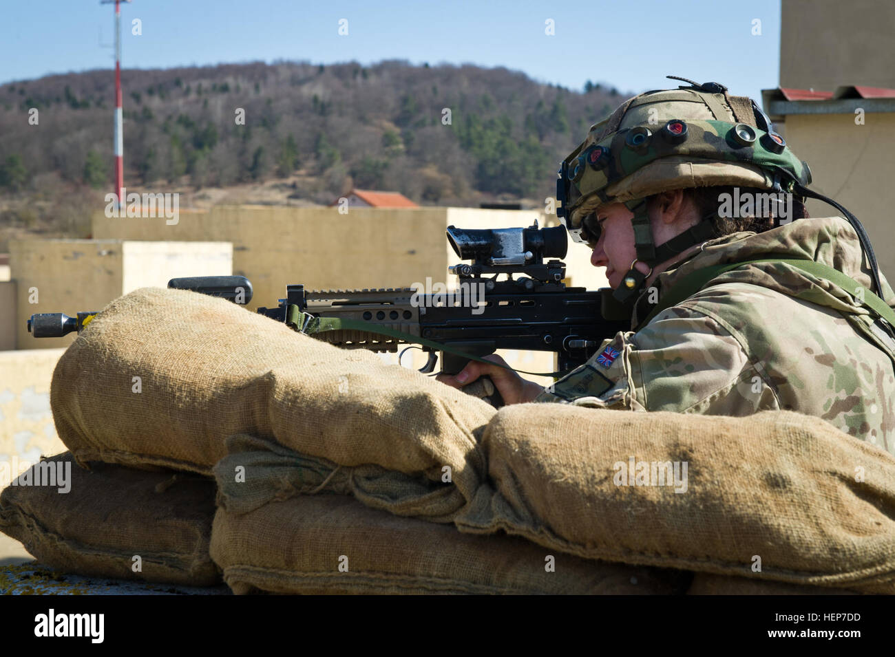 A British cadet of the Royal Military Academy Sandhurst provides ...