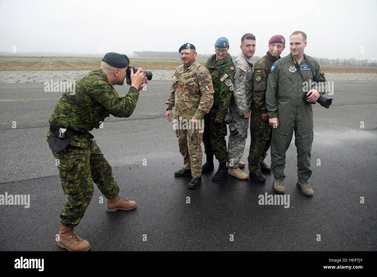 Canadian Sgt Yannick Bedard, Combat Camera, takes a photo before ...