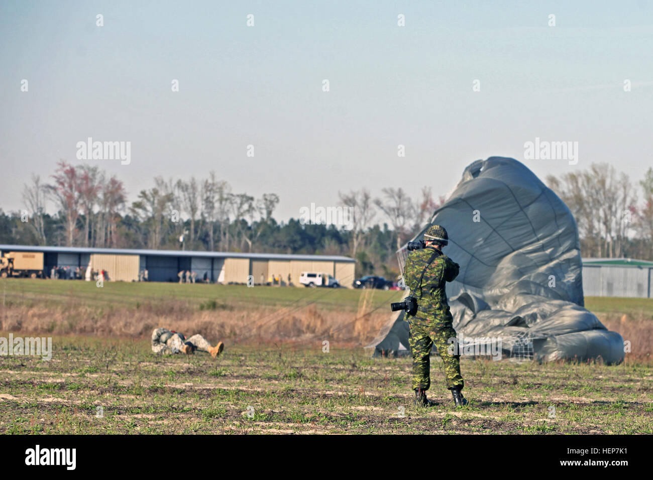 Canadian Combat Camera photographs a U.S. Army paratrooper at ...