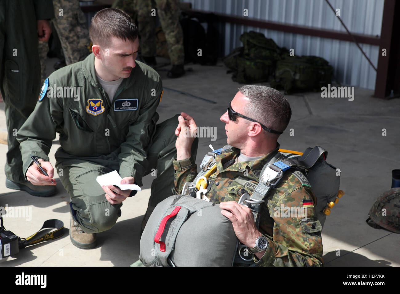 U.S. Air Force Staff Sgt. Matthew Fredericks talks to German Sgt. Maj ...