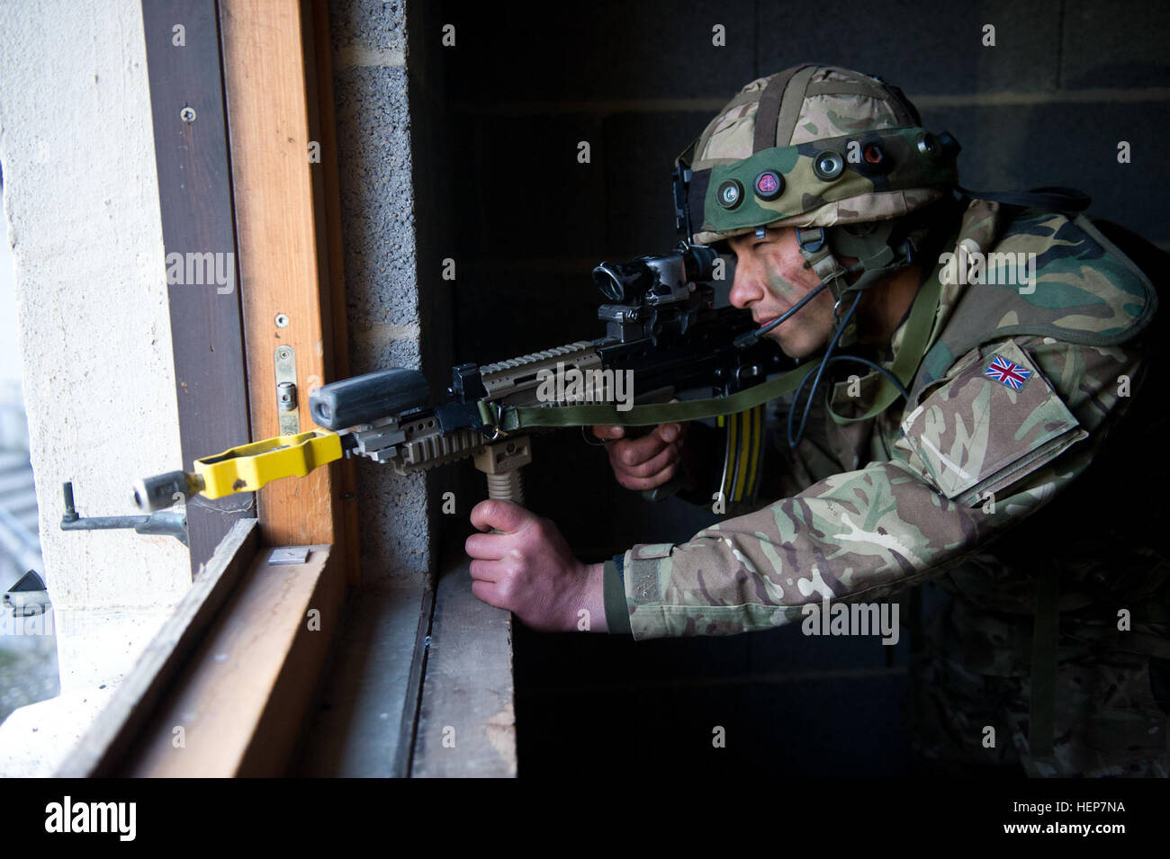A British cadet of the Royal Military Academy Sandhurst looks for ...