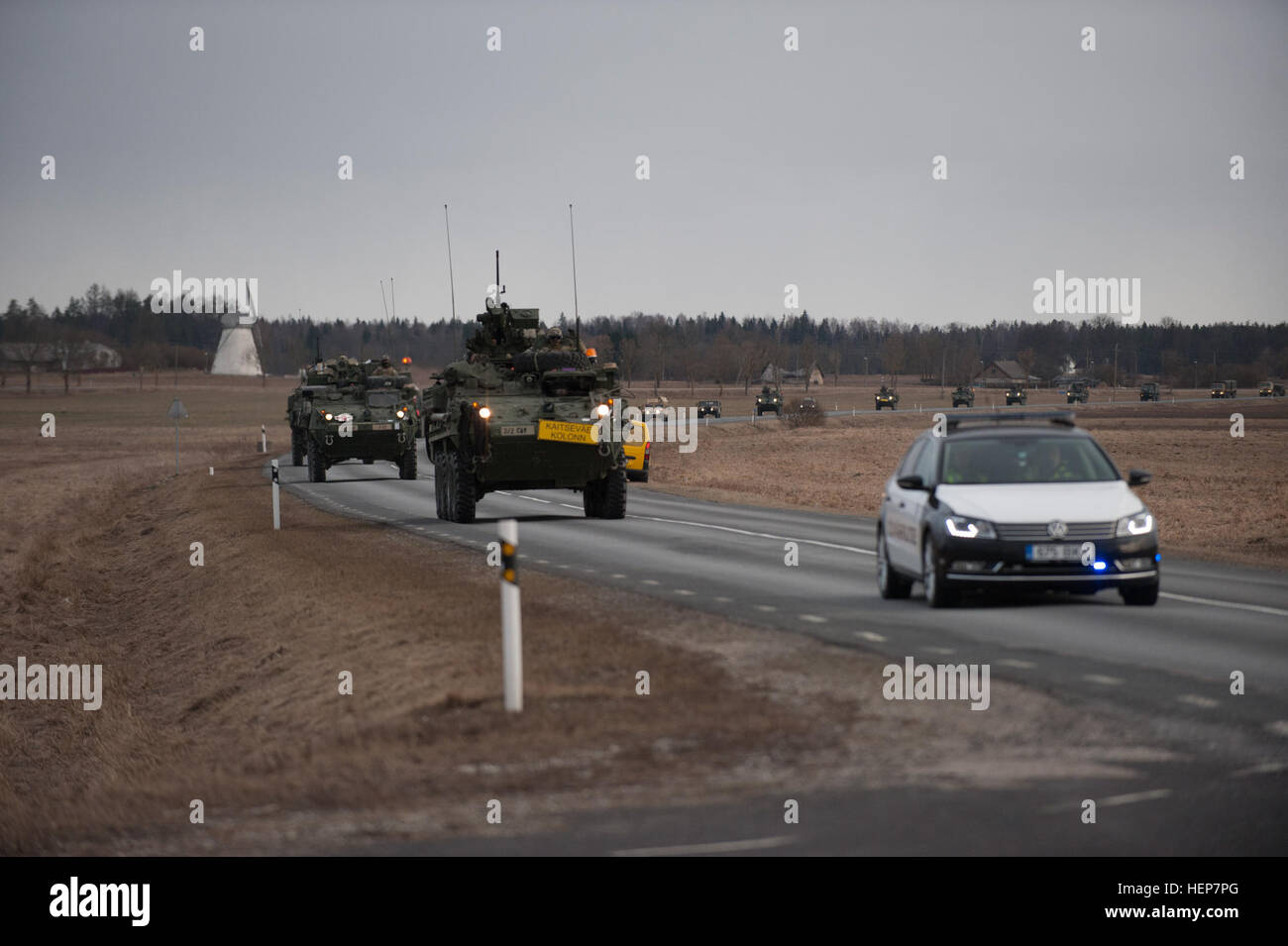 Estonian military police escort Stryker armored vehicles down Highway 5 ...