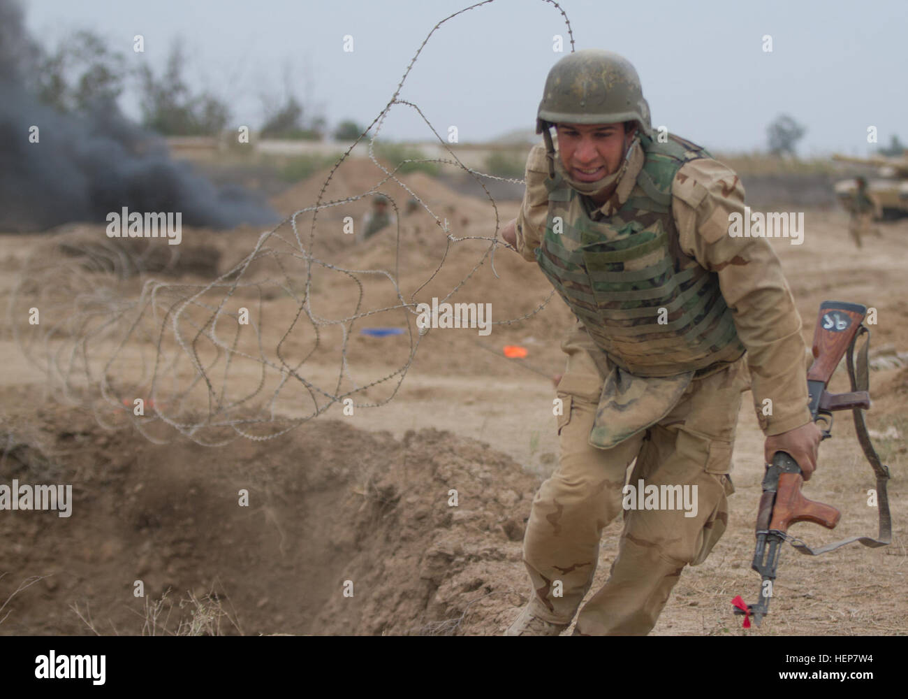 An Iraqi Army engineer with the 72nd Brigade, 15th Division moves ...