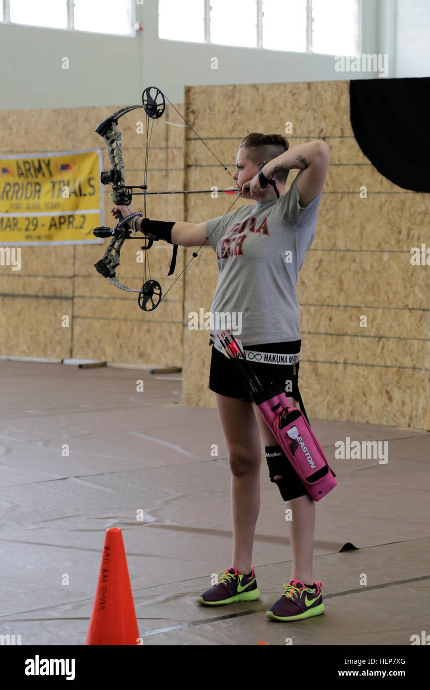 U.S. Army Spc. Laurel Cox, Fort Belvoir, Va., aims during target ...