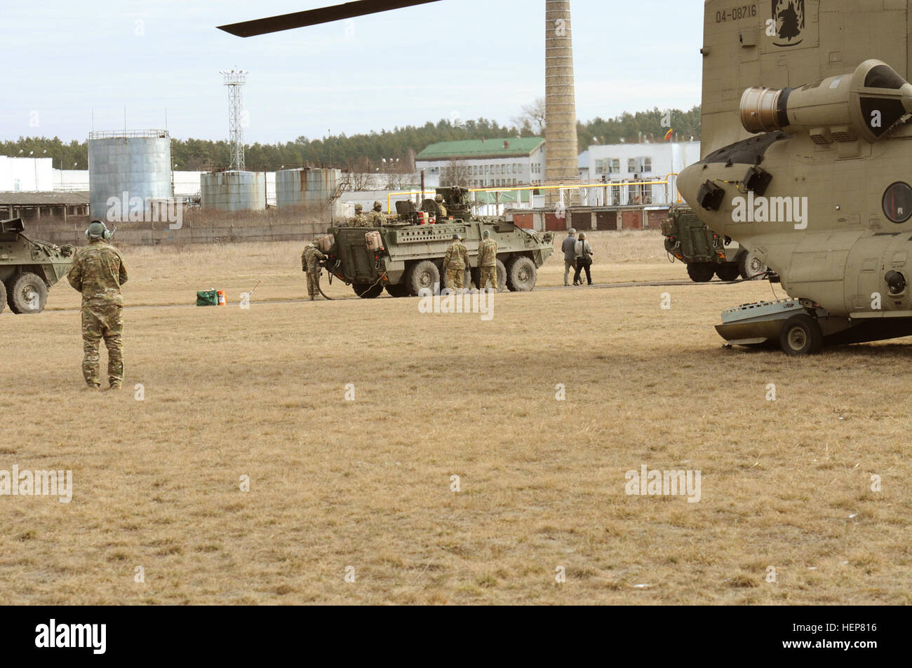 Soldiers from 12th Combat Aviation Brigade refuel strykers from 3rd ...
