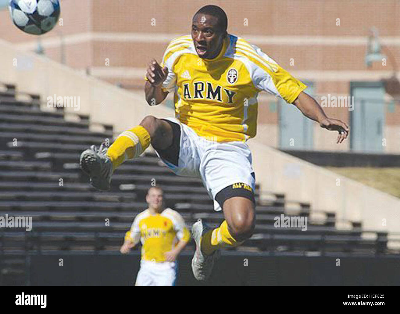Staff Sgt. Titus Kamau, an All Army Soccer player, advances the ball ...