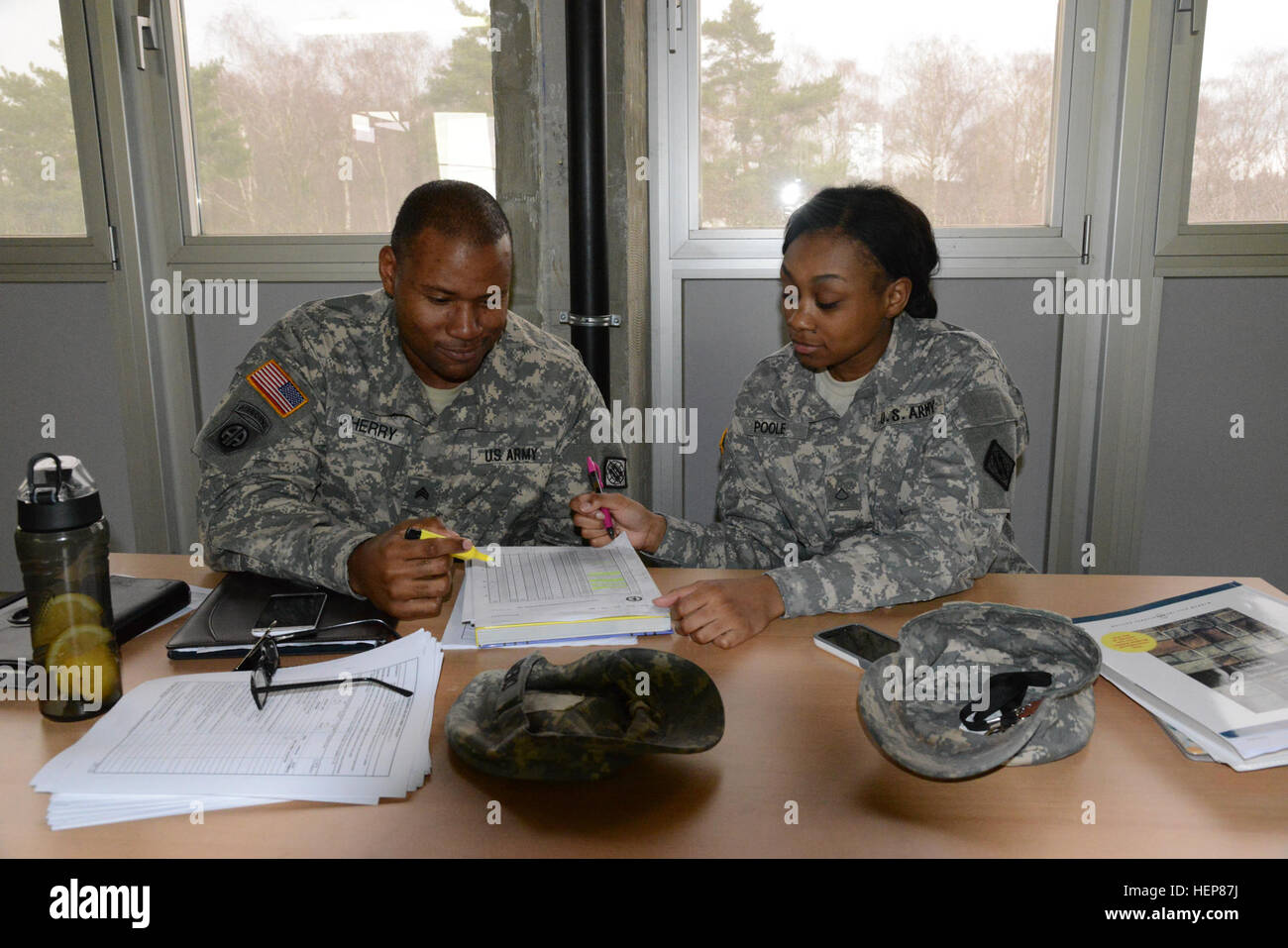 U.S. Army Sgt. Michael Cherry (left) and Pfc Anna Poole run 39th Signal ...
