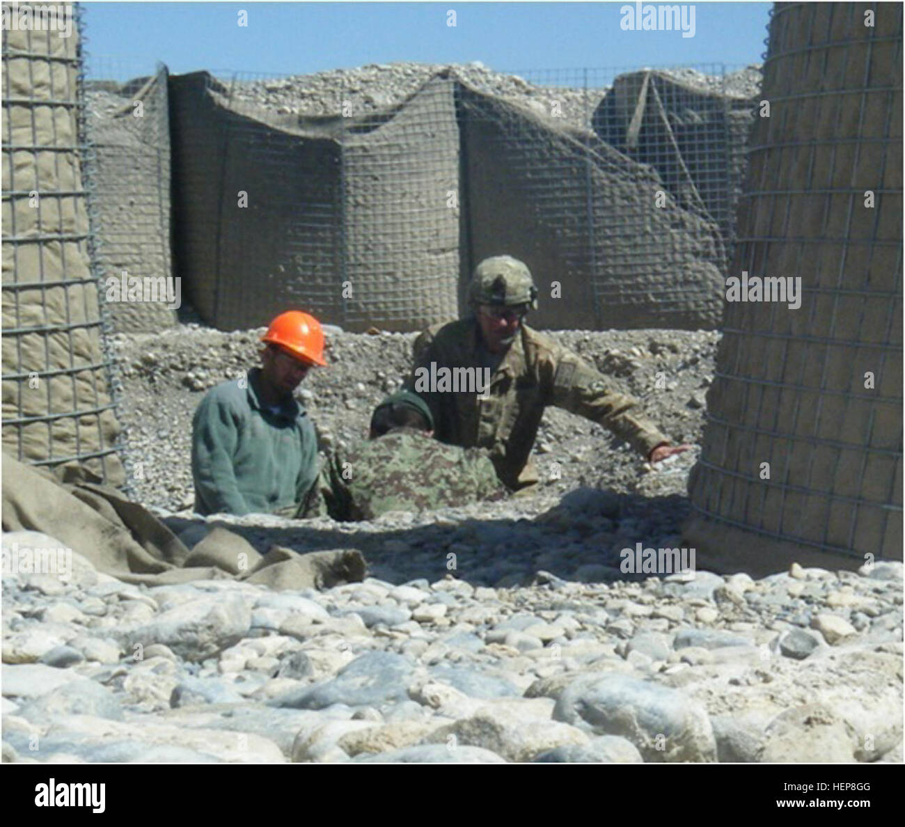 U.S. and Afghan soldiers prepare a demolitions charge in the Afghan ...