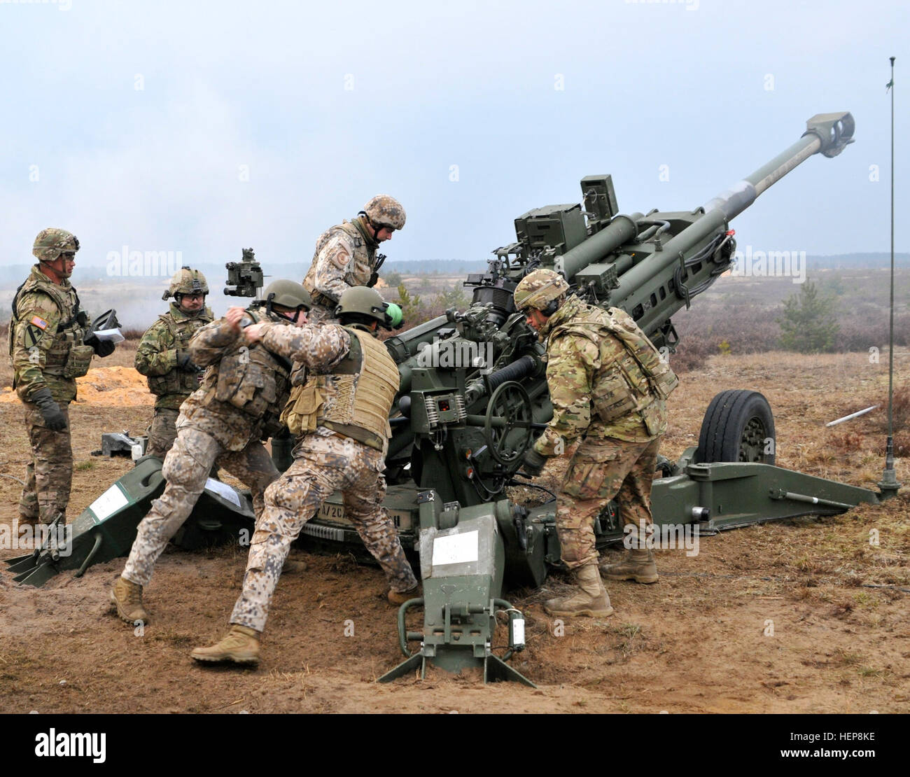 U.S. and Latvian Soldiers operate M777 155mm howitzers at Adazi ...