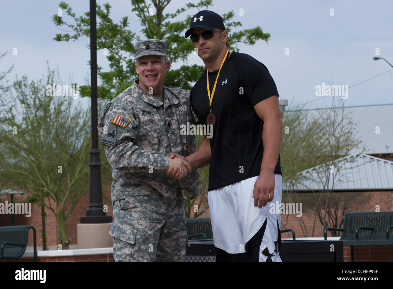 Warrior Transition Command, Command Sgt. Maj. Matthew Brady, shakes the ...