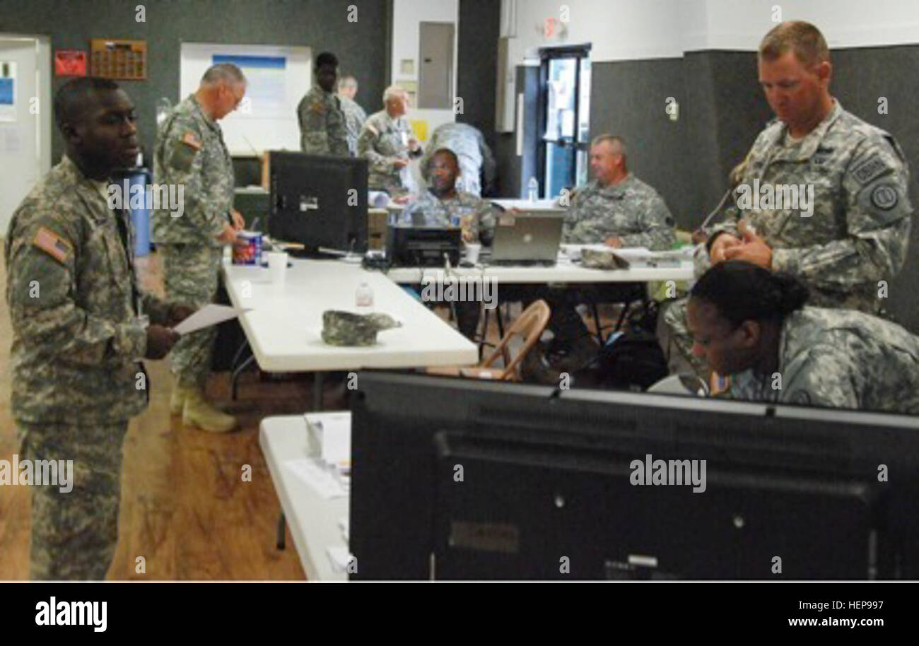 First Lt. Don Jenkins discusses status numbers with the personnel ...