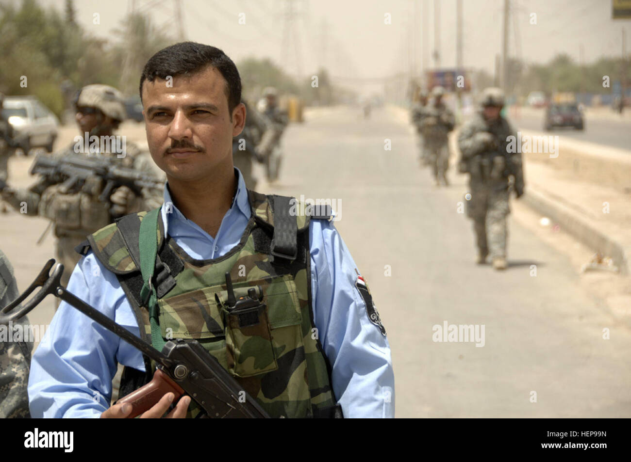 Iraqi police officer Lt. Ali, along with fellow IP Officers, conduct a ...
